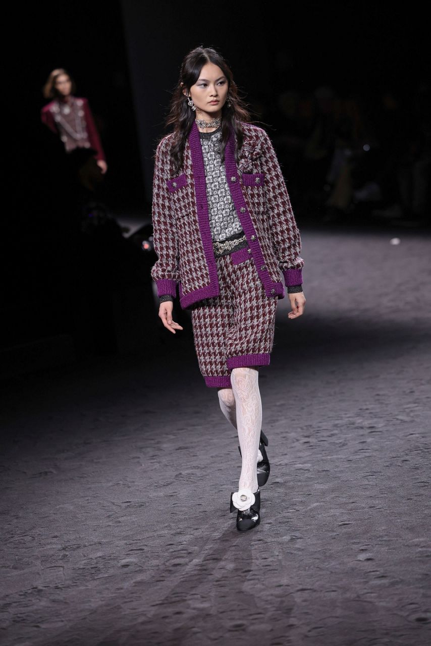 Camellias tower over Chanel's guests for show capping Paris