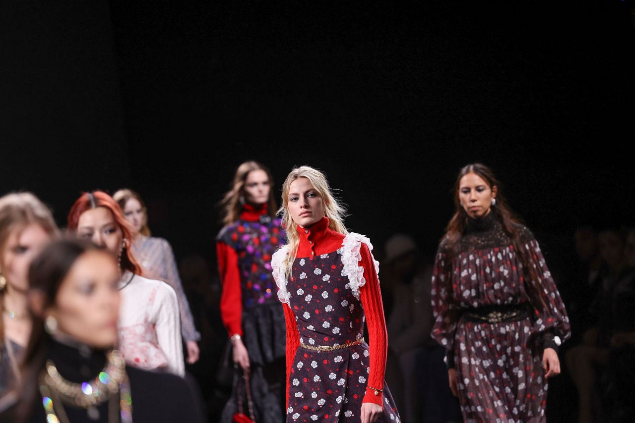 Camellias tower over Chanel's guests for show capping Paris