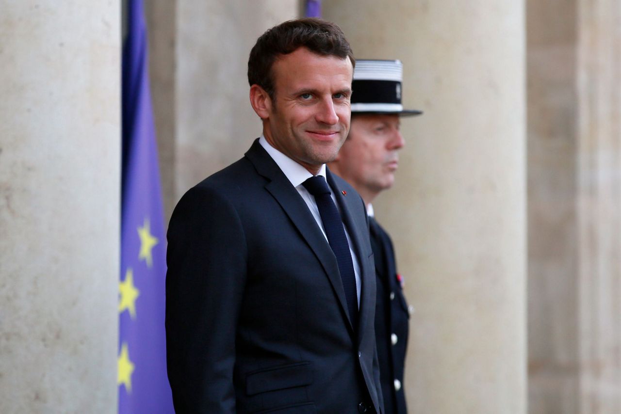 Climate activists on trial for taking down Macron portraits