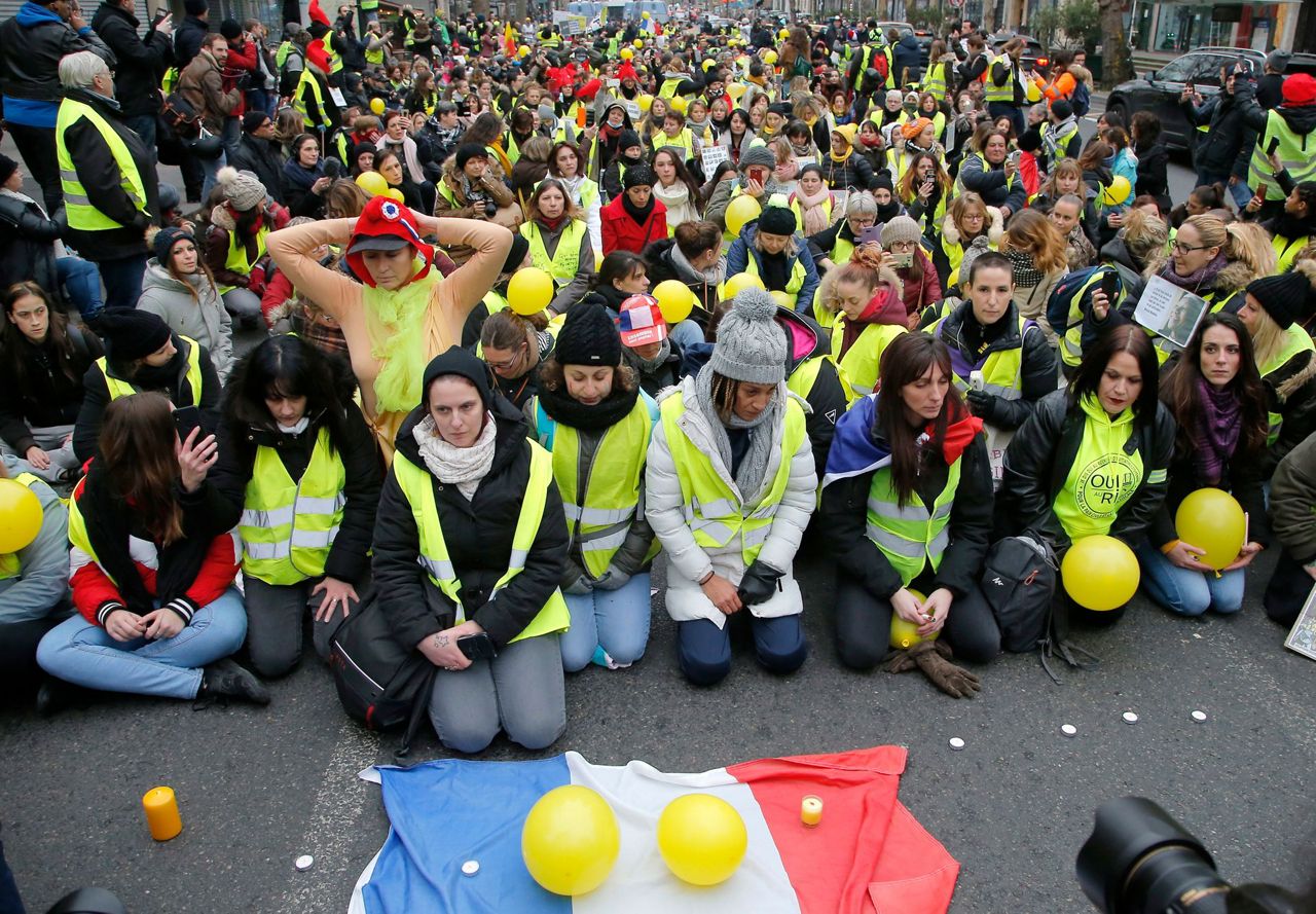 Women of French yellow vest group counter violent image