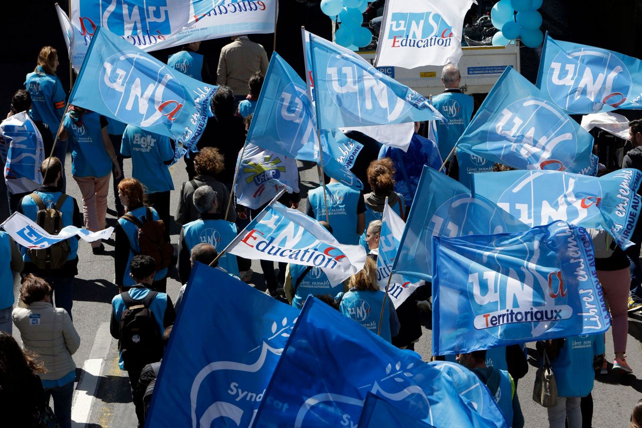 French unions hold strikes, protests against Macron policies