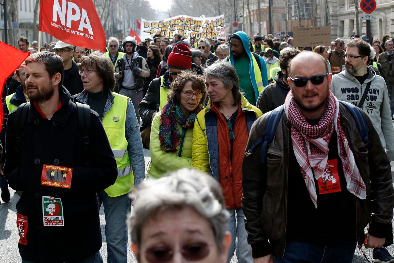 The Latest: Thousands of yellow vests marching through Paris
