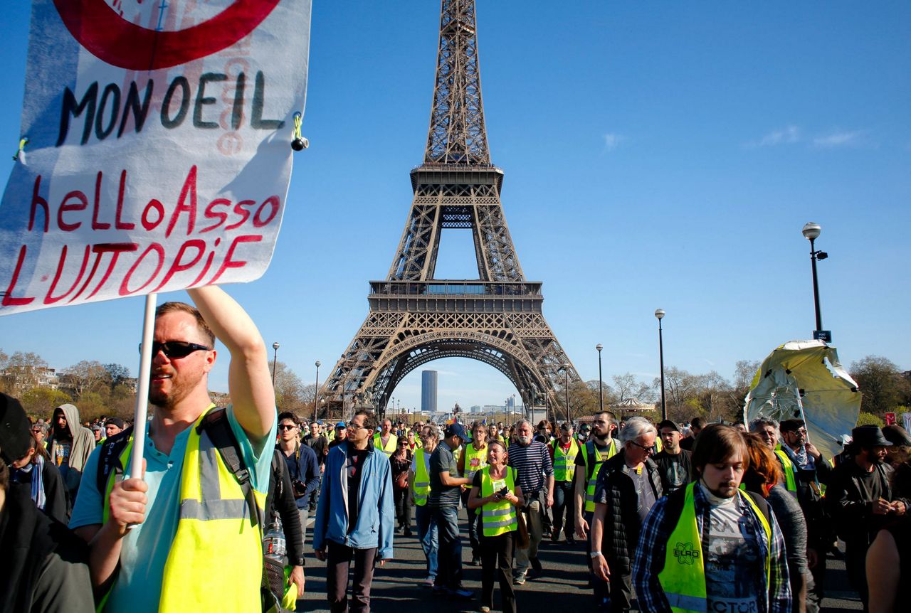 France's yellow vest protesters march despite bans, injuries