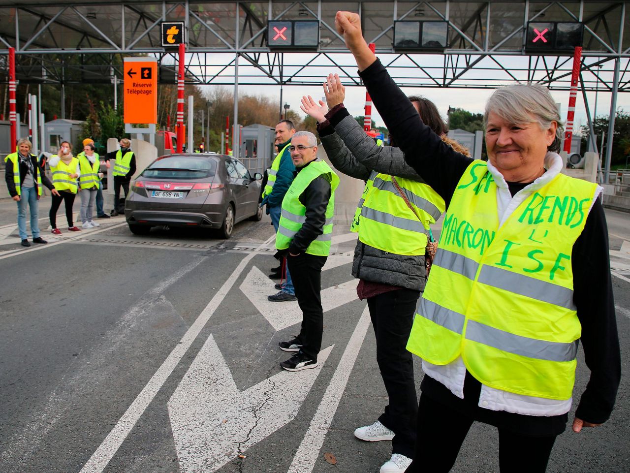 France bracing for more protests despite retreat on taxes