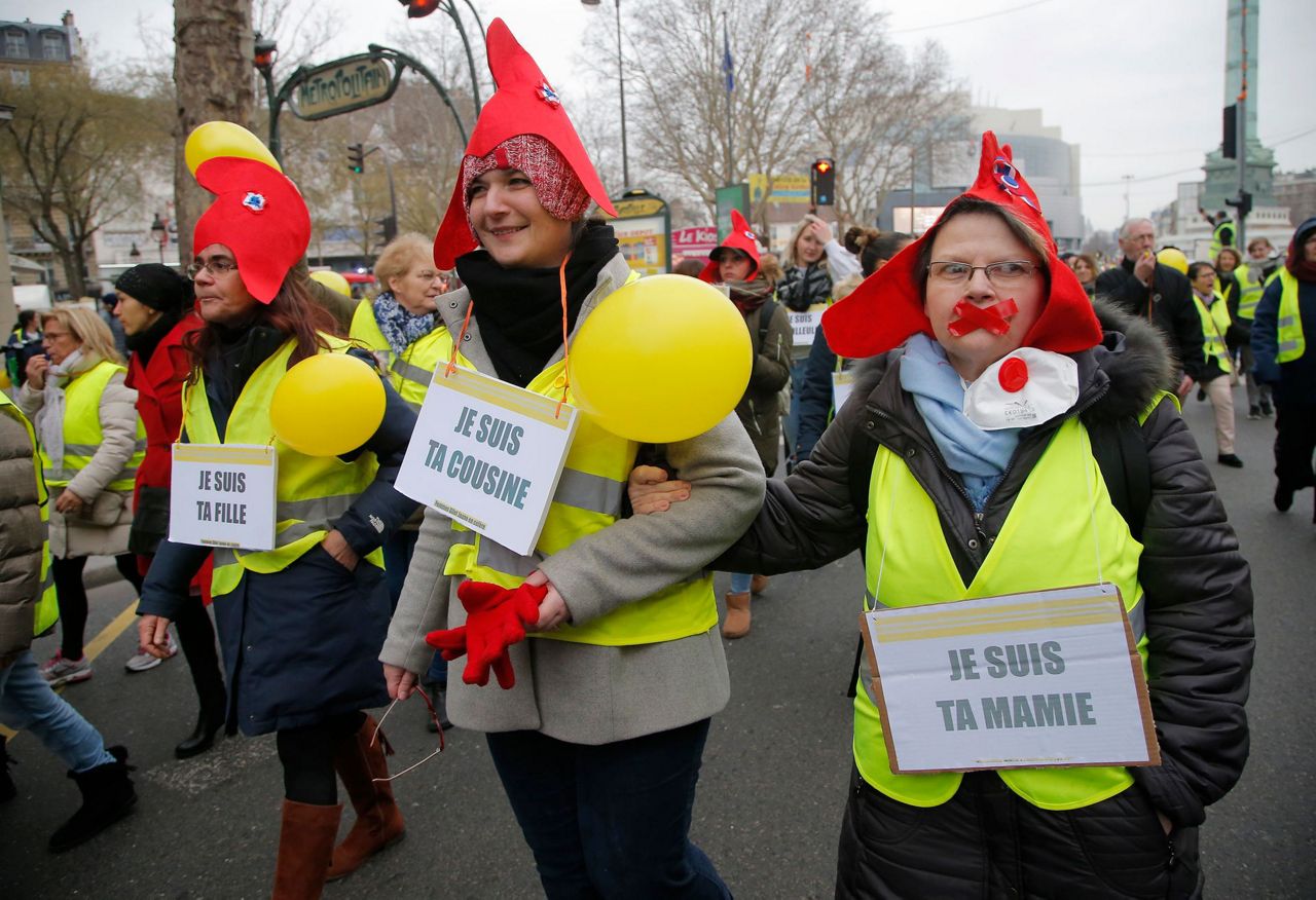 Women of French yellow vest group counter violent image