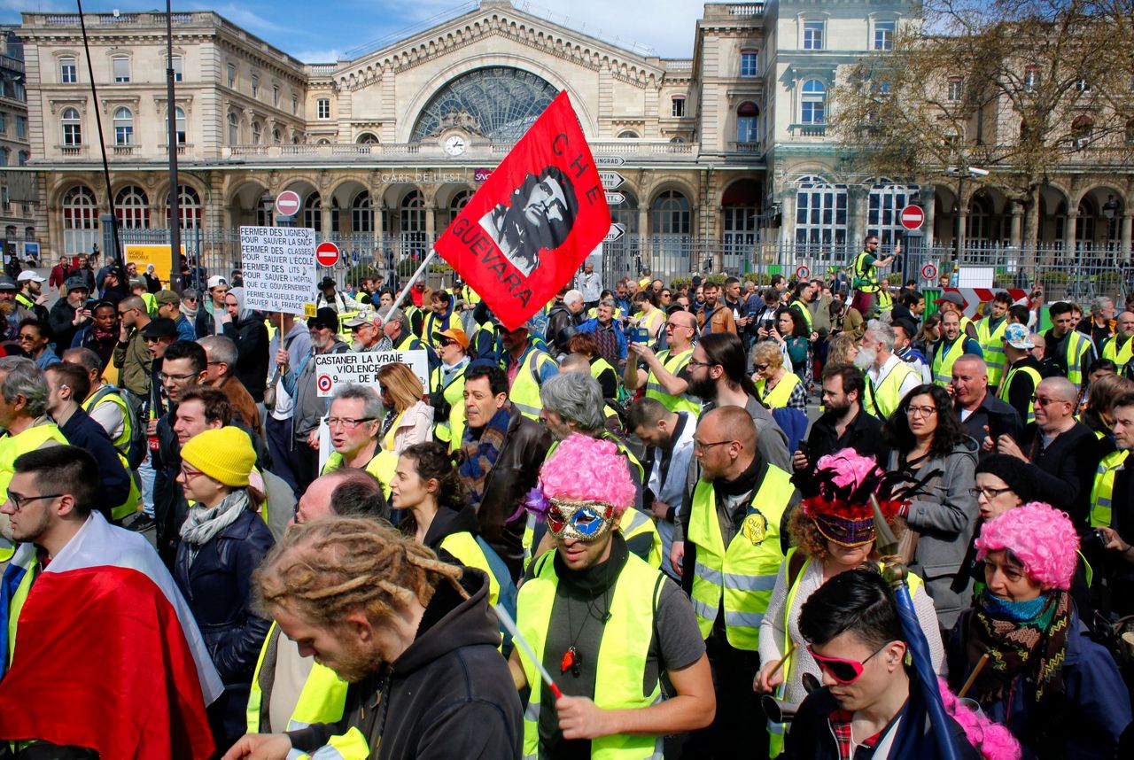 France's yellow vest protesters march despite bans, injuries