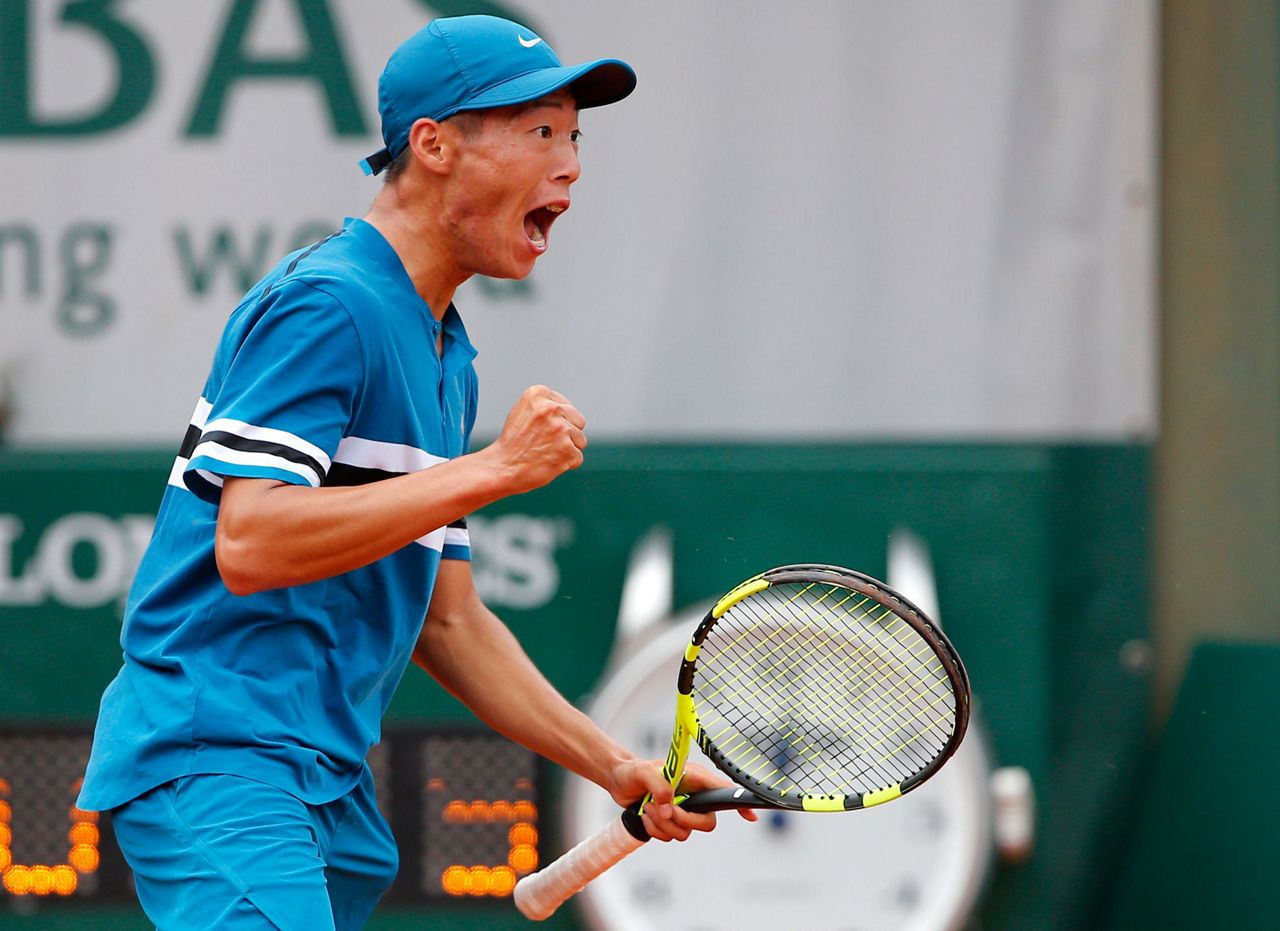 The Latest: Tseng wins boys' title in Paris