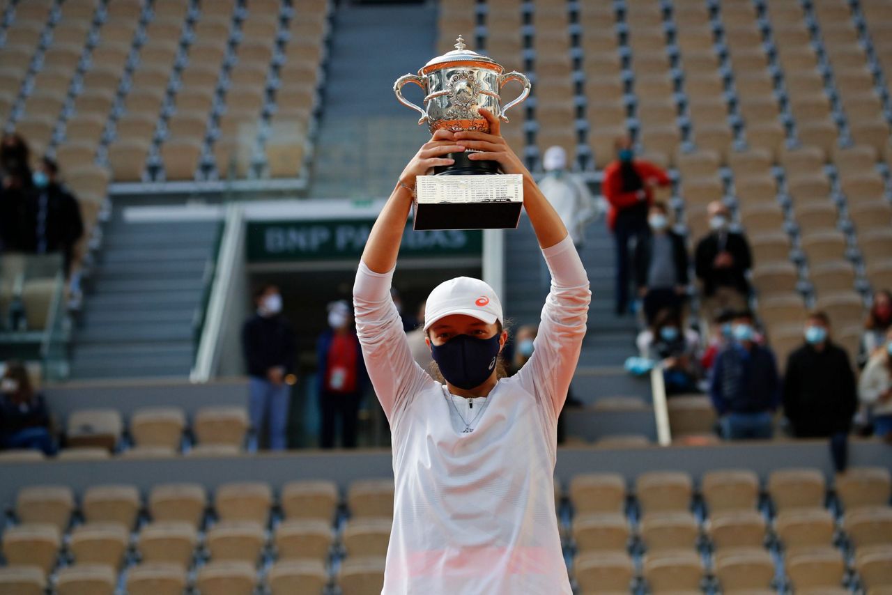 The Latest: Stricker wins French Open boys' title