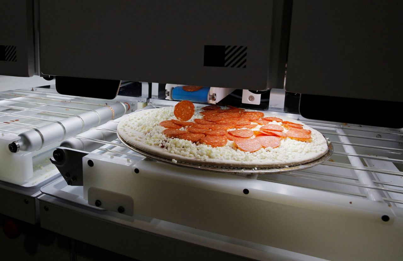 CES Gadget Show: Pizza from robots, underwater scooters