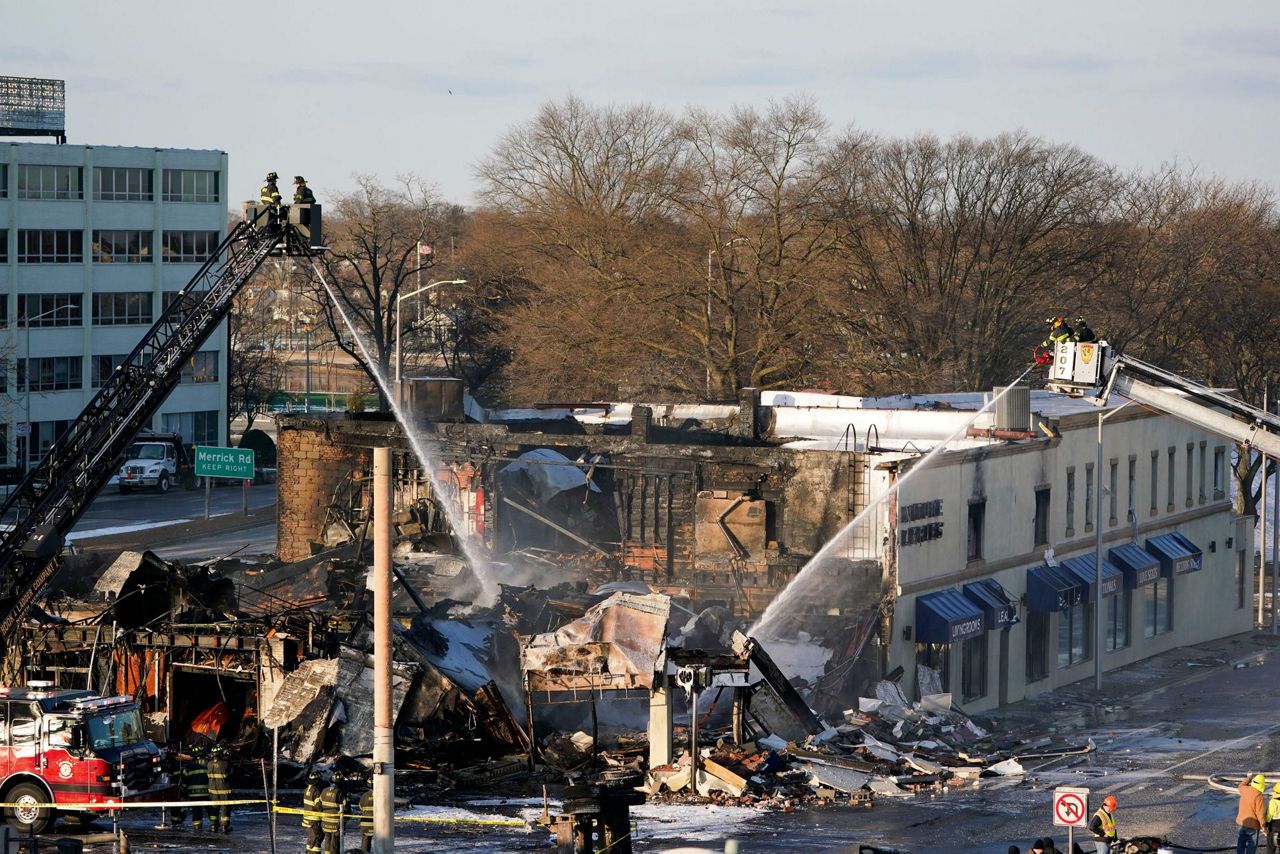 Gasoline tanker crashes into building, bursts into fireball