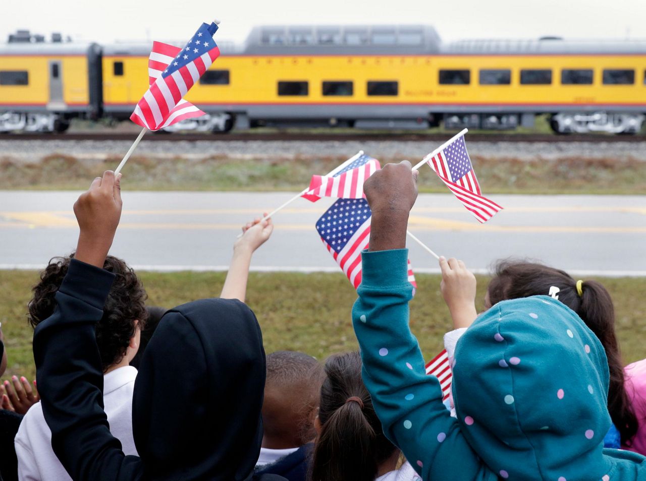 Flag-waving crowds in Texas watch Bush's funeral train