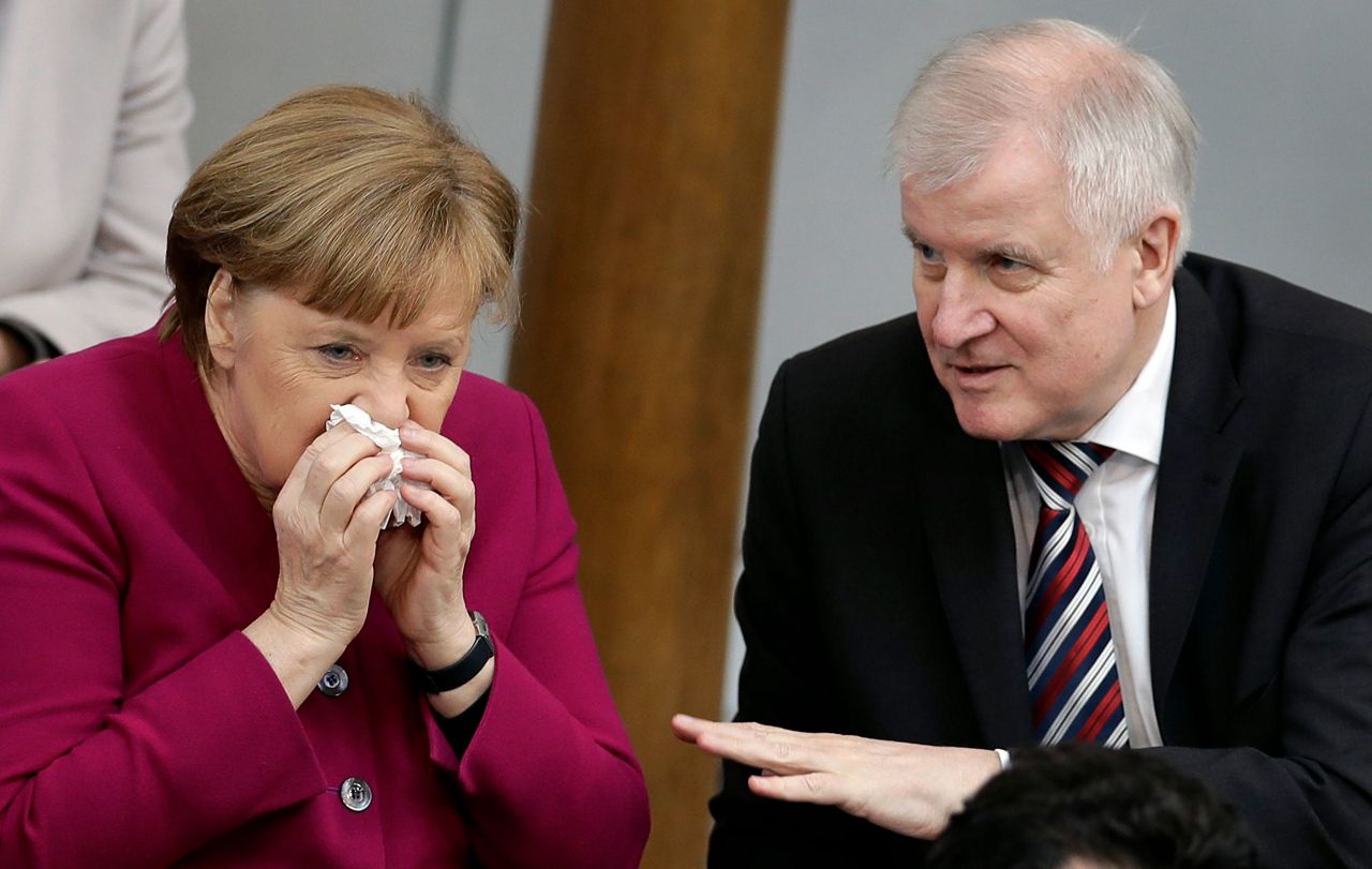German govt stands but no resolution in fight over migration