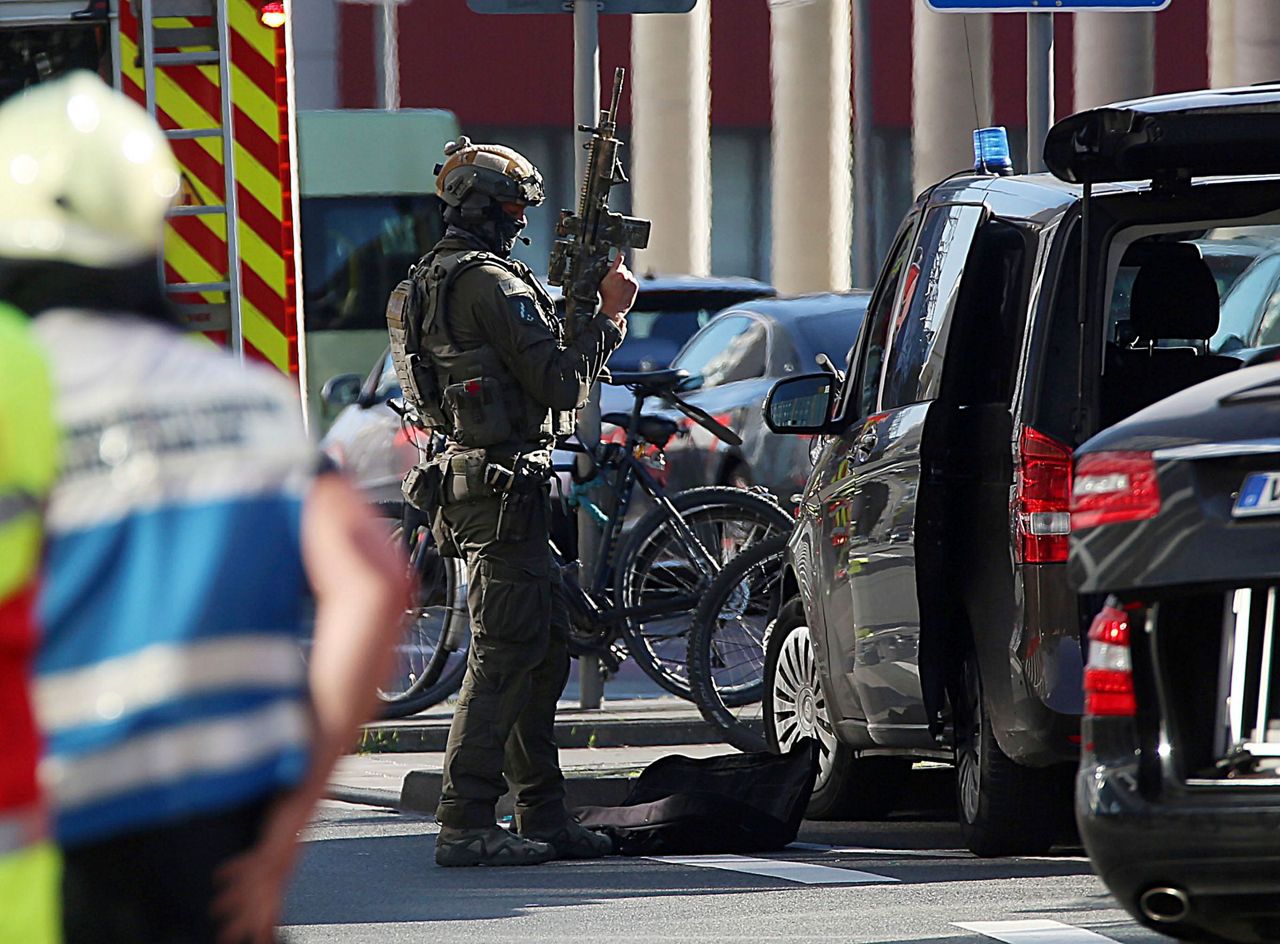 The Latest: Hostage freed at German station, man detained