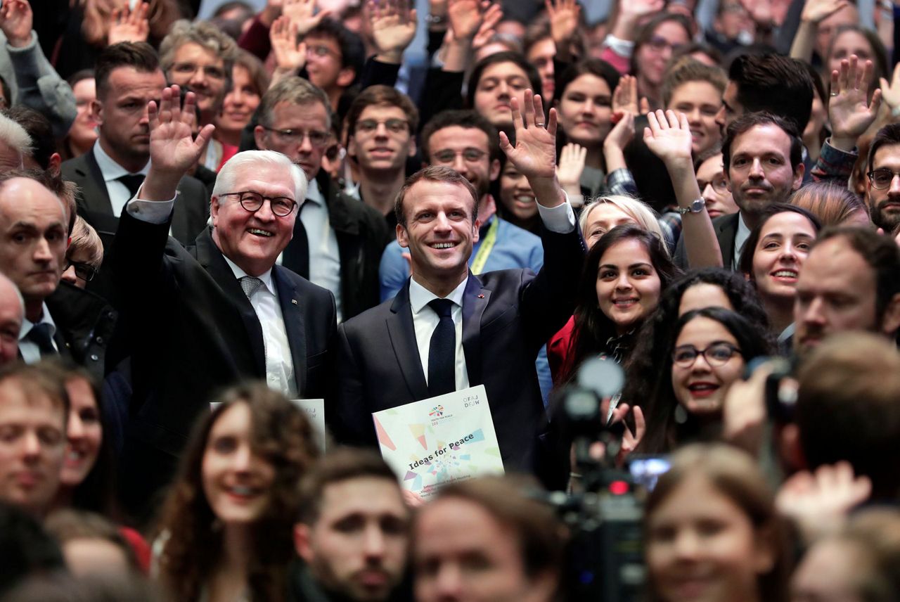 Macron, Merkel seek common approaches to Trump, euro