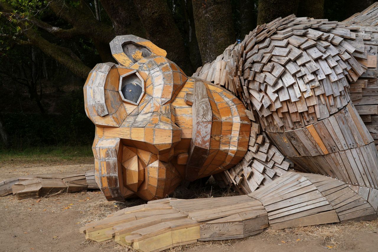 Giant trolls built from trash want to save humans from themselves