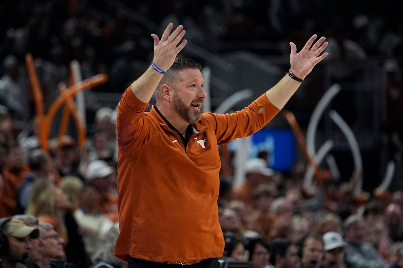 Texas coach Beard arrested on felony family violence charge