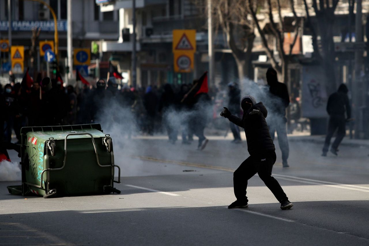 Greek protesters attack police with petrol bombs at rally