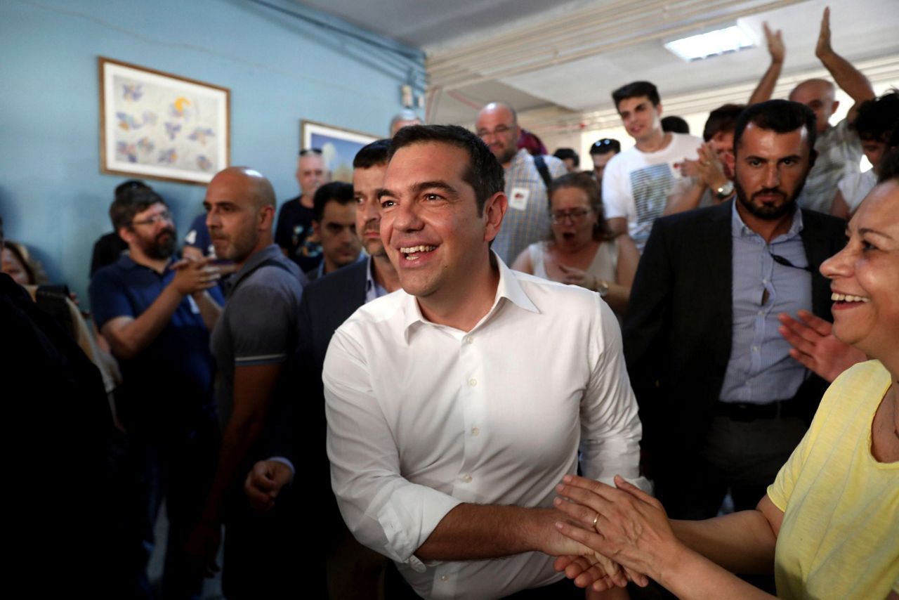 The Latest: Exit polls give conservative Greek election win