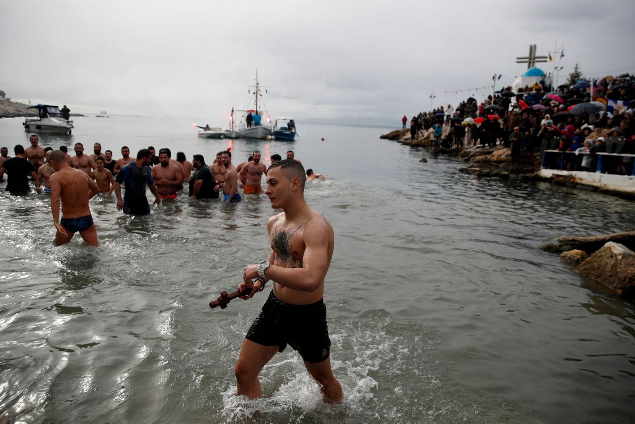 Seeking the cross: Icy dips mark the feast of Epiphany