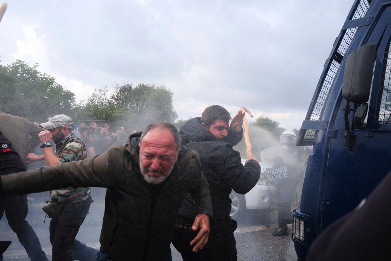 Protesting Greek farmers swarm onto apron area of international airport ...