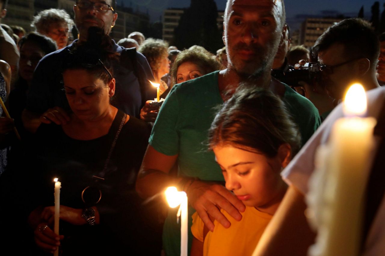 Greek PM visits area damaged by deadly forest fires