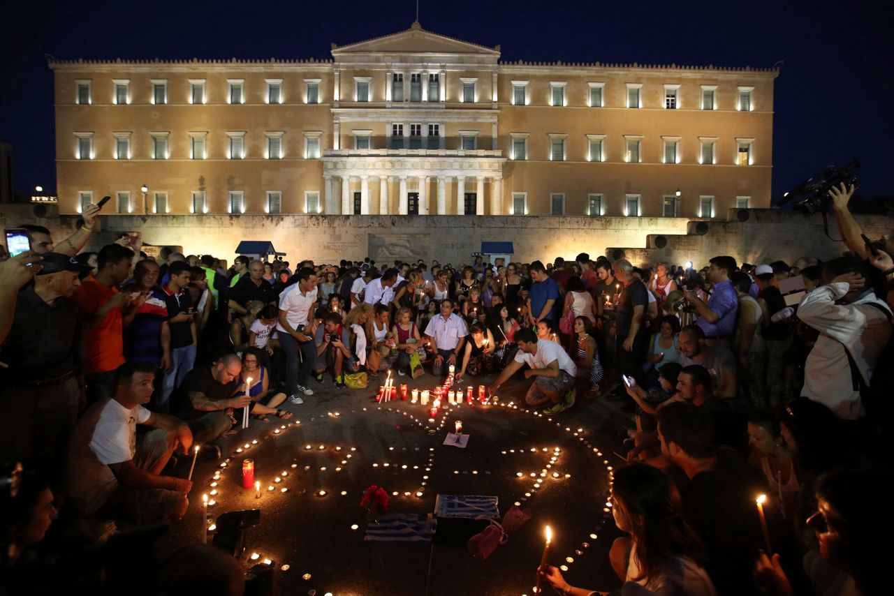Greek PM visits area damaged by deadly forest fires