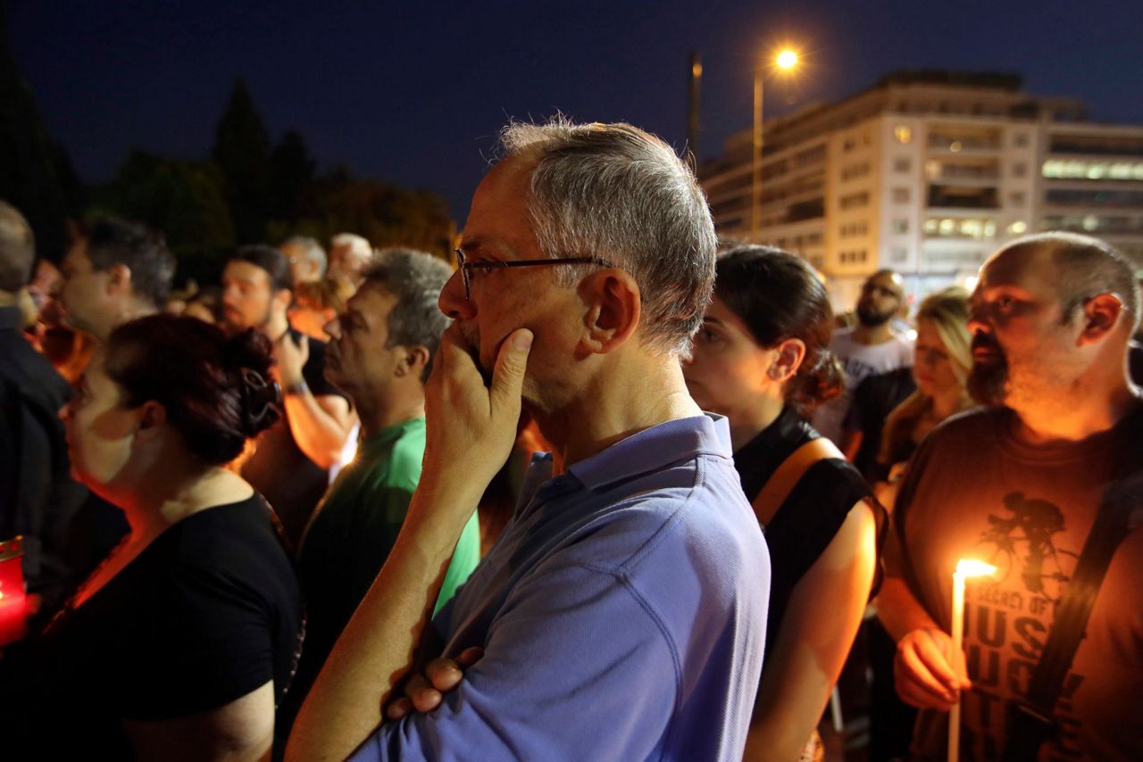 Greek PM visits area damaged by deadly forest fires