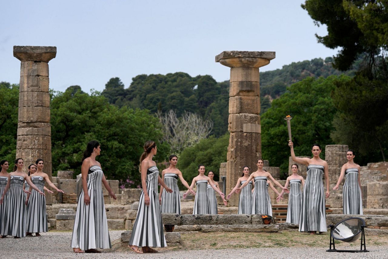 Despite weather glitch, the Paris Olympics flame is lit at the Greek ...