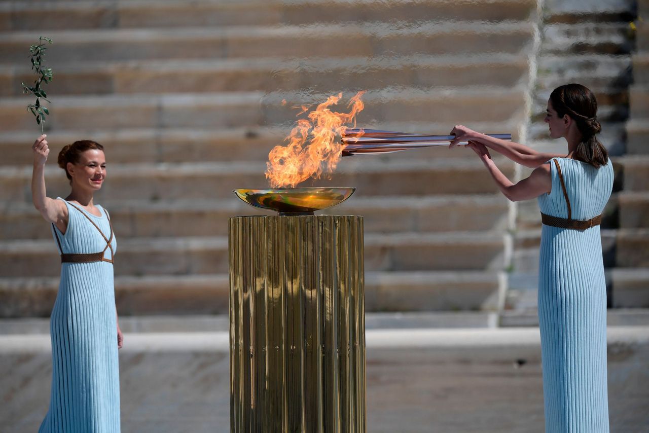 The Latest: Olympic flame handed over to Japanese delegation