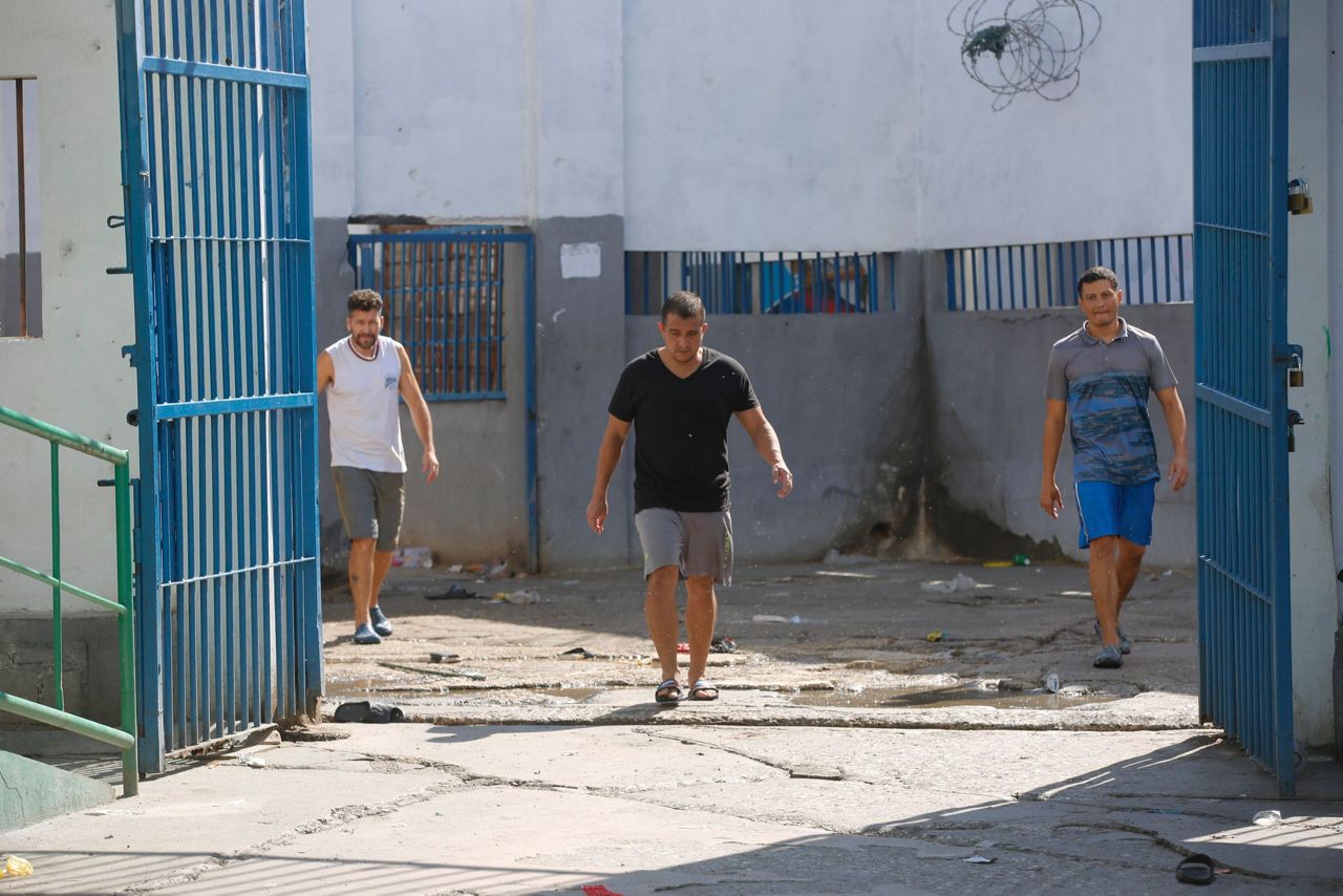 Hundreds of inmates flee after armed gangs storm Haiti's main prison in ...