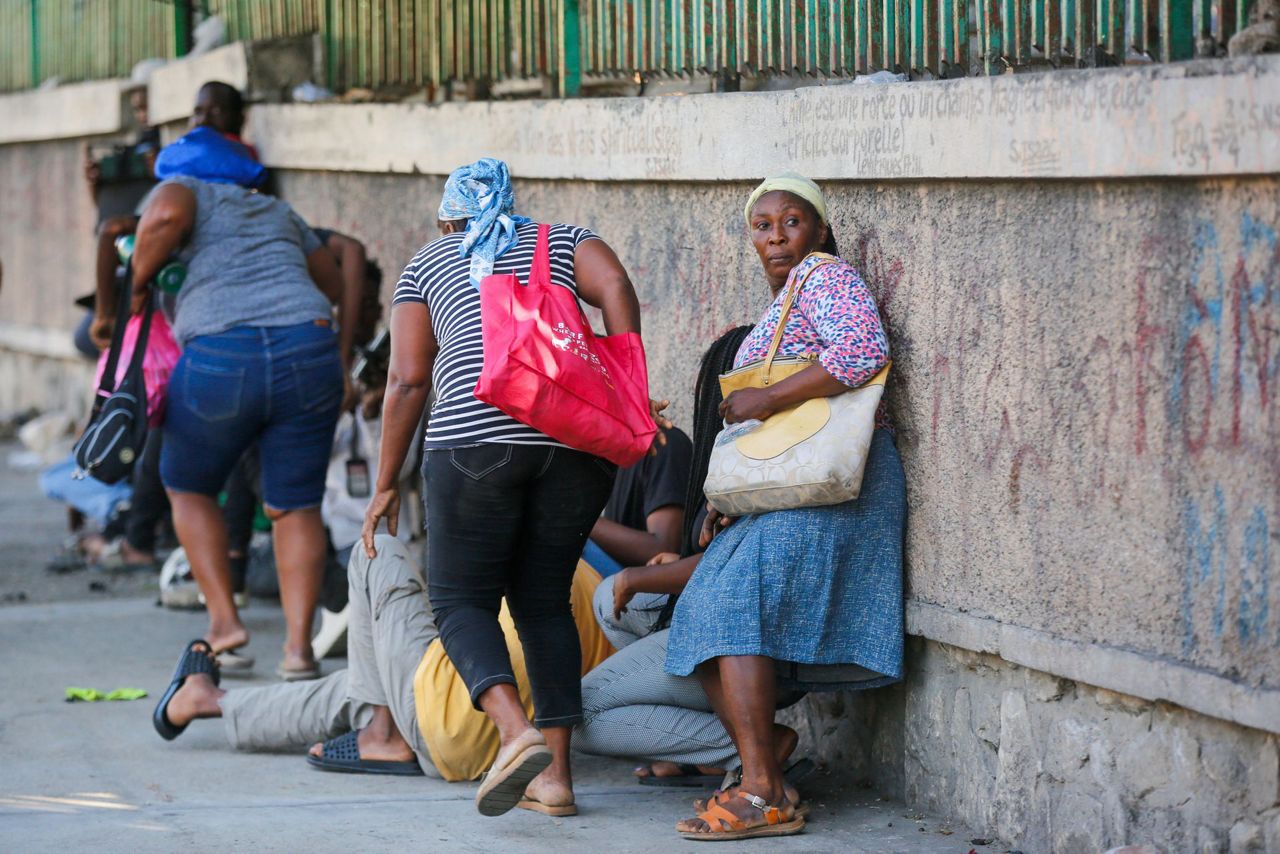 Hundreds of inmates flee after armed gangs storm Haiti's main prison in ...