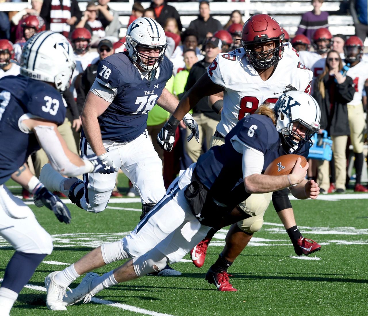 Students storm field at halftime of Harvard-Yale to protest