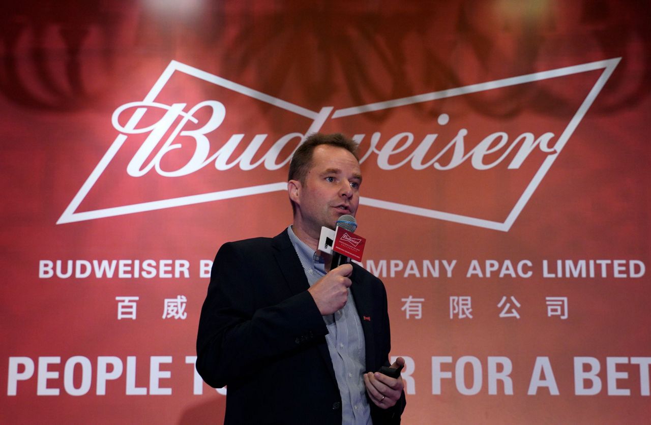 World's top brewer revives listing plans, halves IPO size