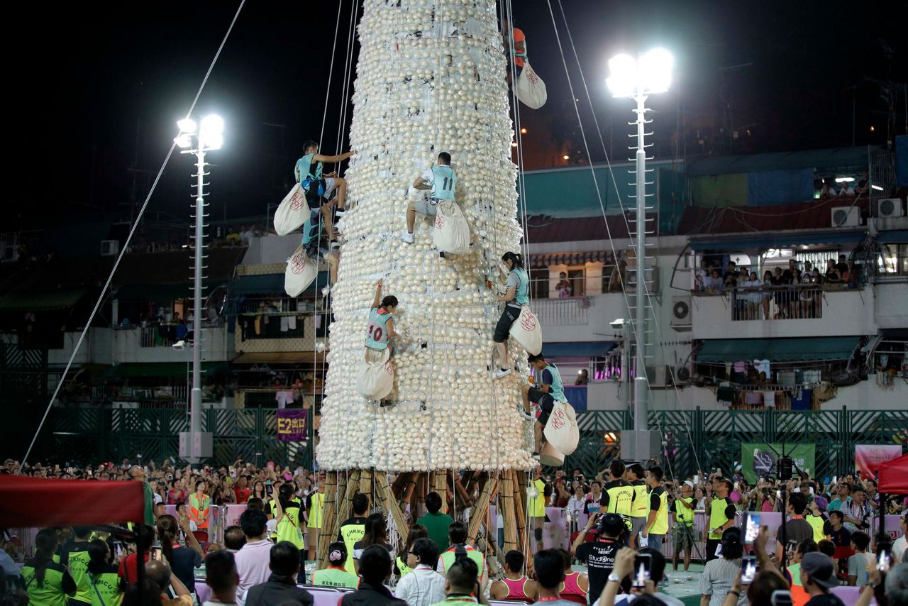 AP PHOTOS: Thousands join Hong Kong bun-snatching festival