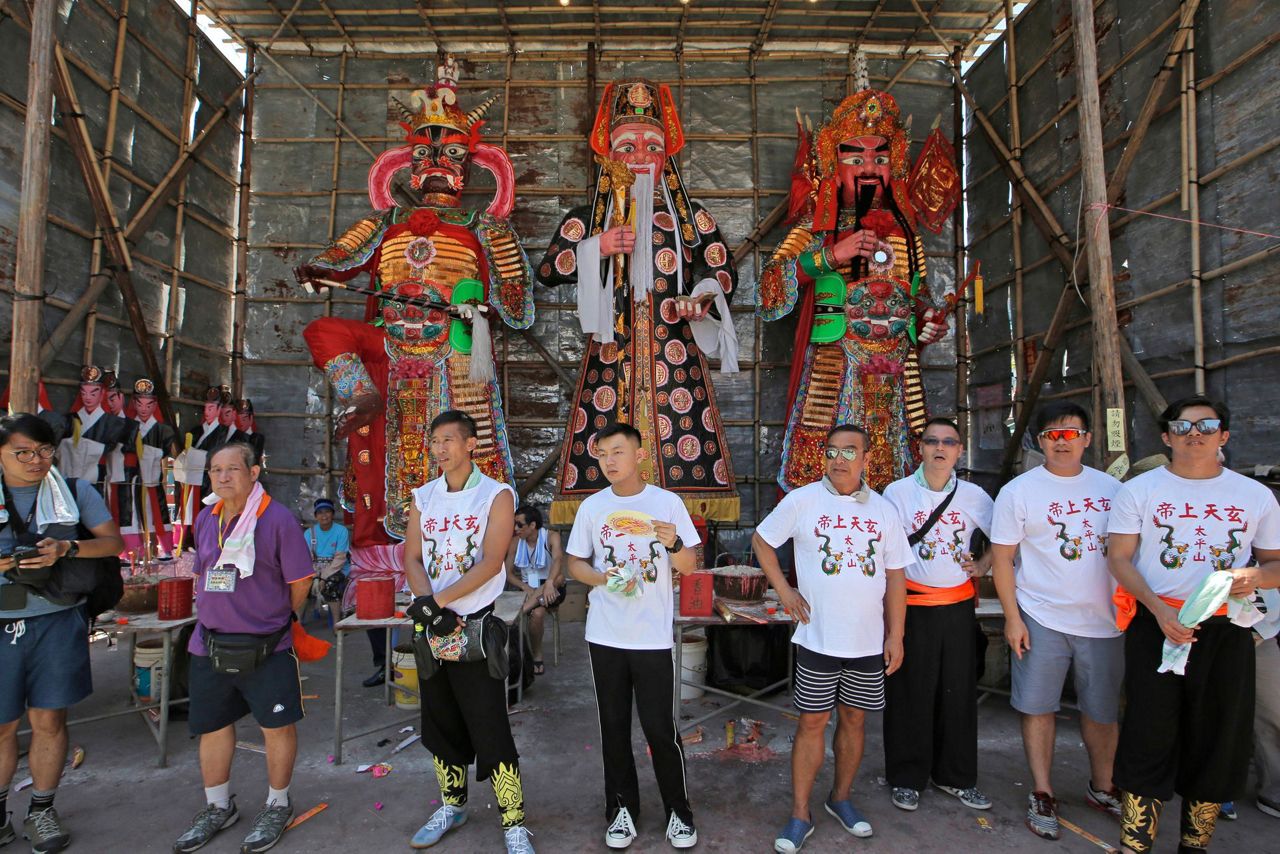 AP PHOTOS: Thousands join Hong Kong bun-snatching festival