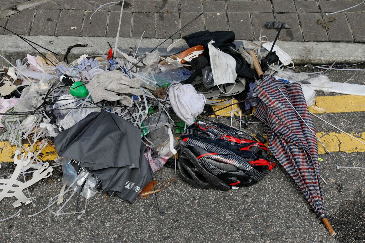AP PHOTOS: Umbrellas, a Hong Kong protest symbol, broken