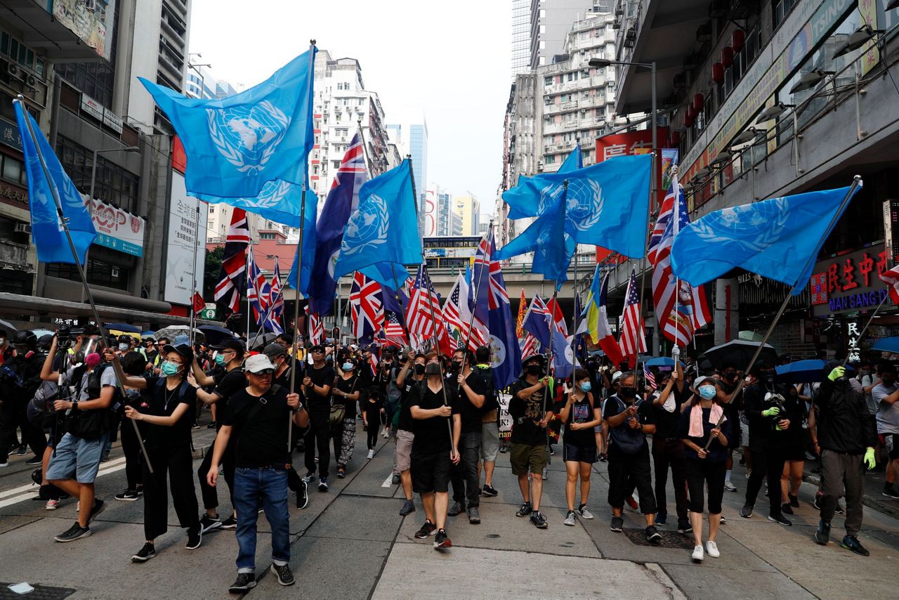 Pro-China supporters in Hong Kong rally ahead of anniversary