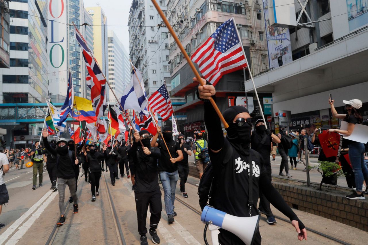 Pro-China supporters in Hong Kong rally ahead of anniversary