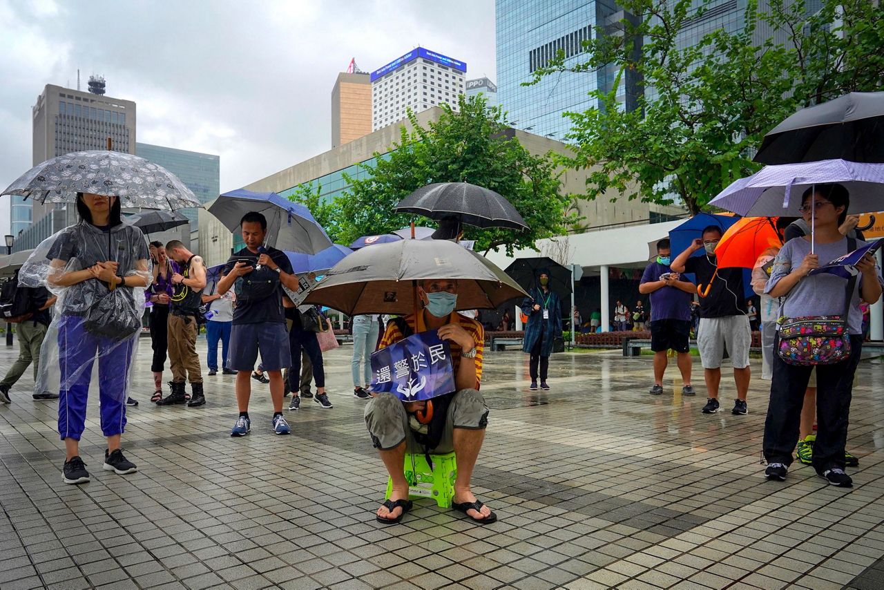 Hong Kong protesters gather in rain for pro-democracy march