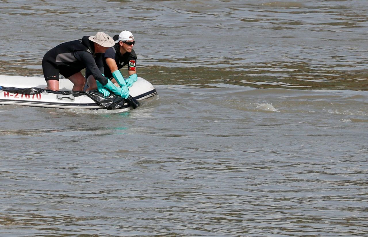 The Latest: Body of 13th victim recovered from sunken boat