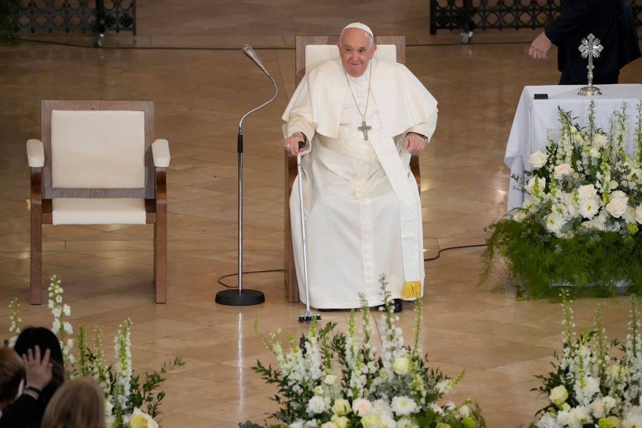 Pope visits refugees, urges Hungary to show charity to all