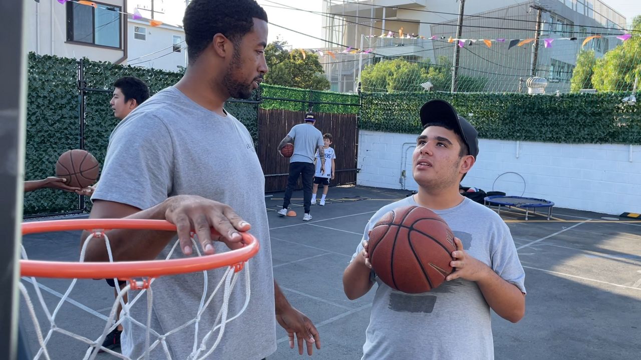 Dad builds hoops program for kids with autism