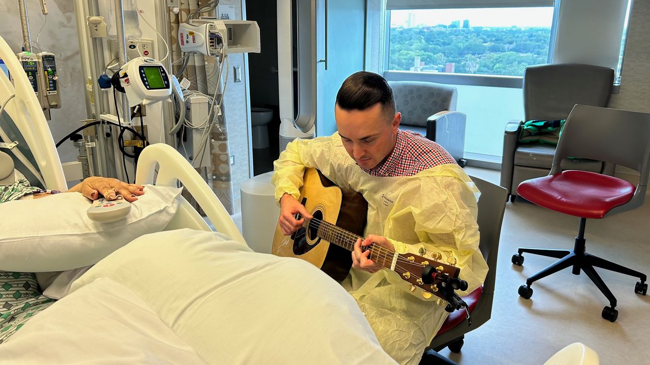 Doctor uses music to lift patients’ spirits