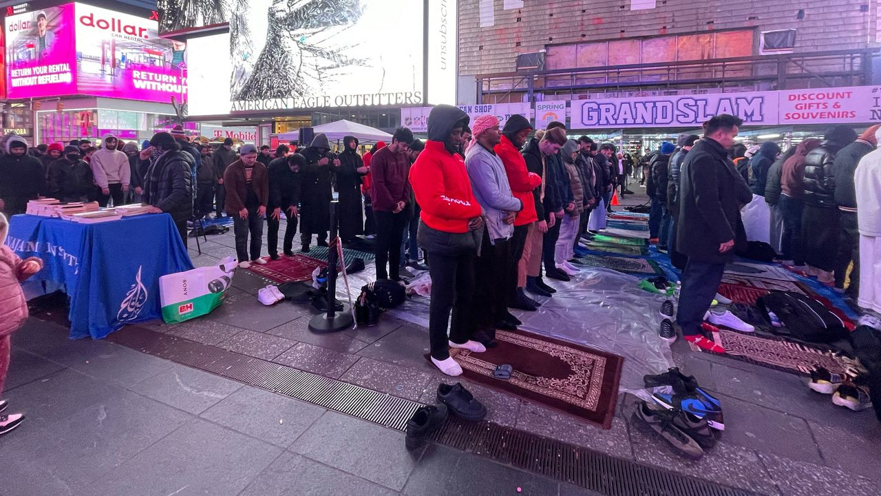 Muslims pray in Times Square on the first night of Ramadan
