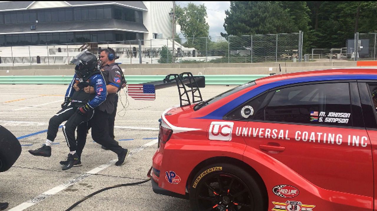 Paraplegic race car driver scores 1st pro win, seeks more