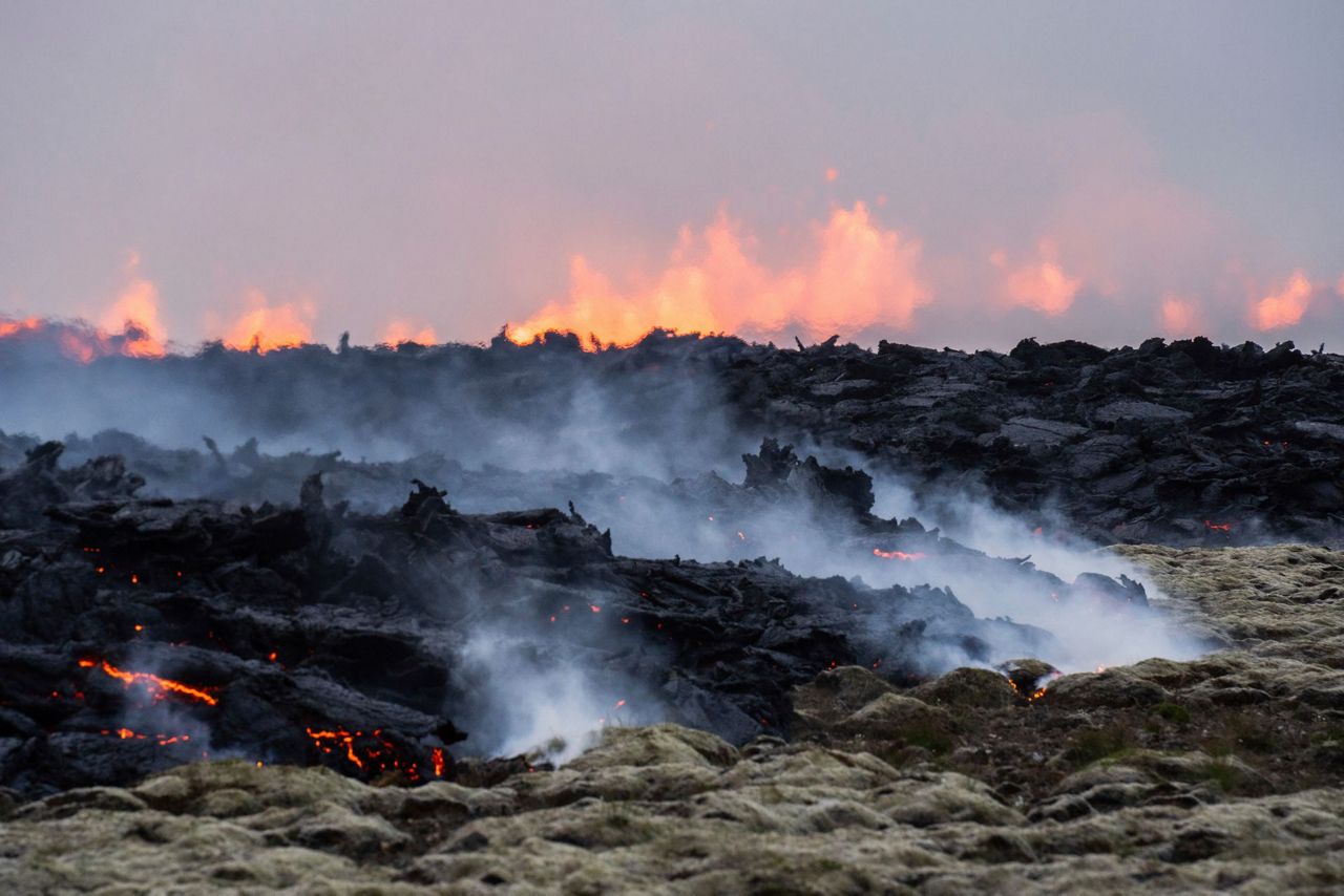Tourists are told to stay away from an erupting volcano in Iceland ...