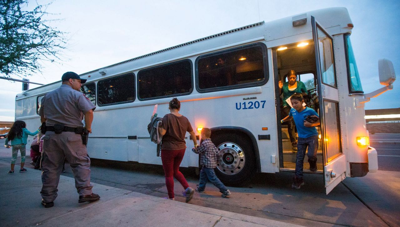 APNewsBreak: Migrant families must wait outside bus stations
