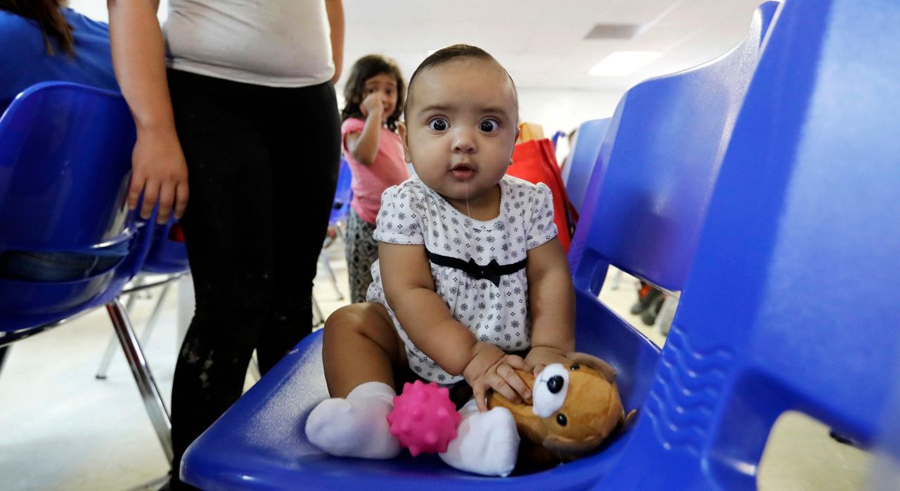At hub for border crossings, families spread throughout US