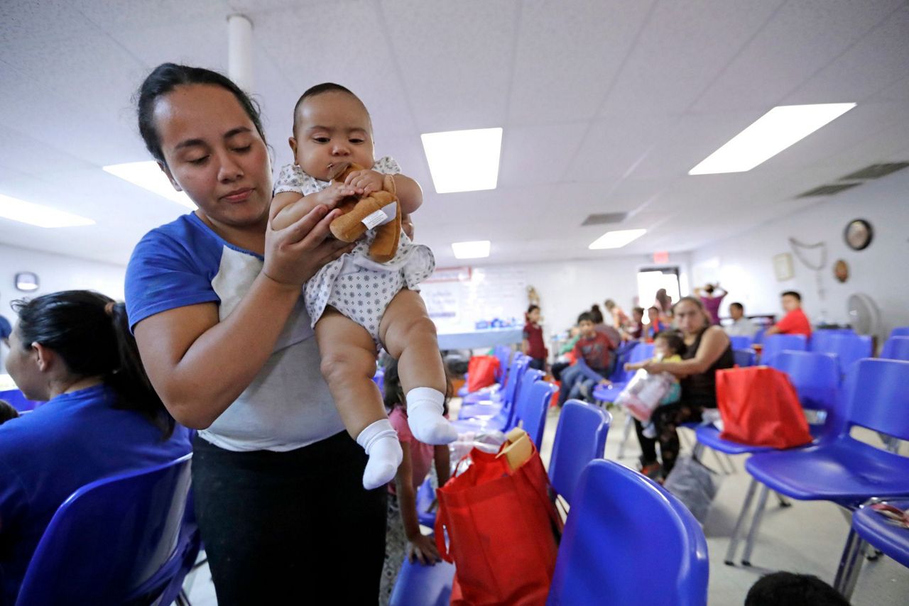 At hub for border crossings, families spread throughout US