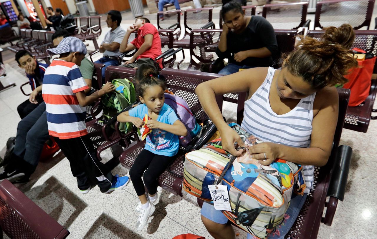 At hub for border crossings, families spread throughout US